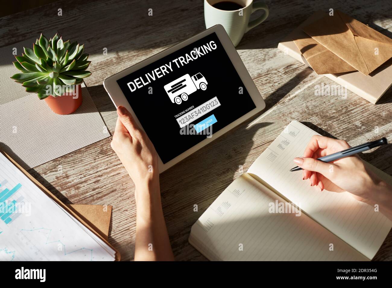 Delivery tracking form on device screen. E-commerce and business ...