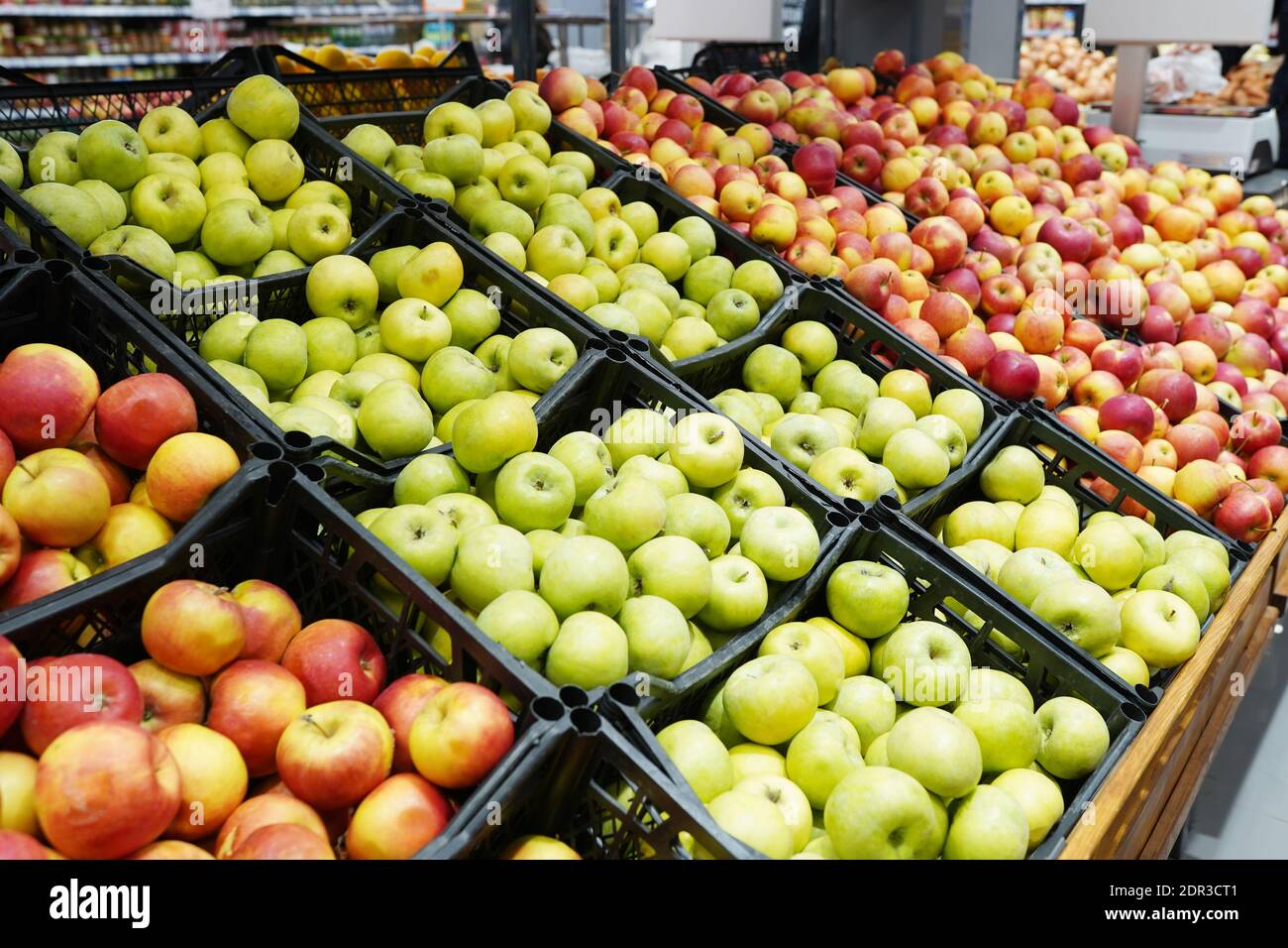 raw apple heaps perspective on market show tray Stock Photo - Alamy