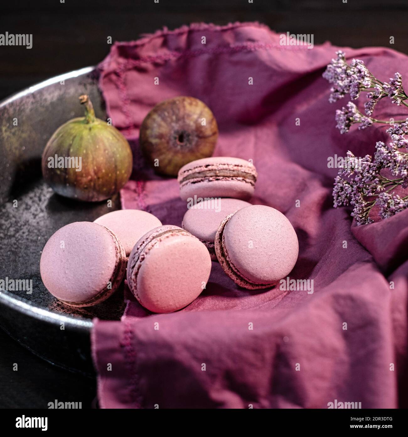 Fig macarons on a metal tray , flowers in the background Stock Photo ...