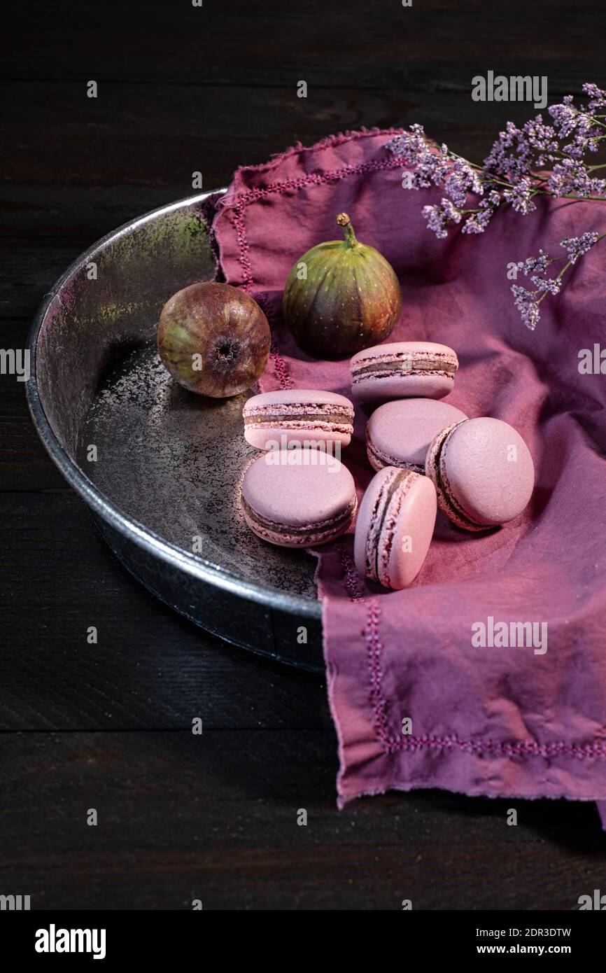Fig macarons on a metal tray , flowers in the background Stock Photo ...