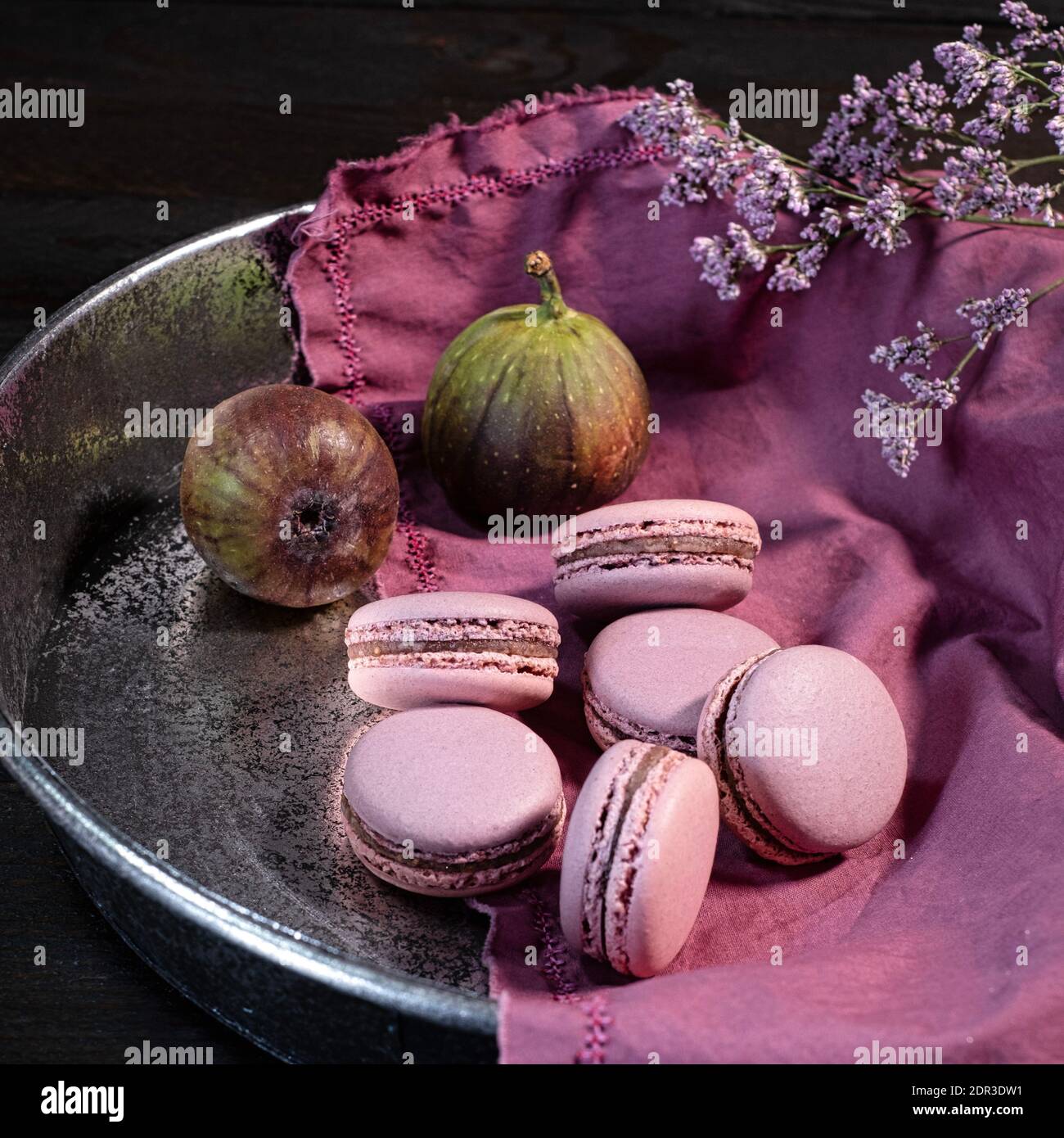 Fig macarons on a metal tray , flowers in the background Stock Photo ...