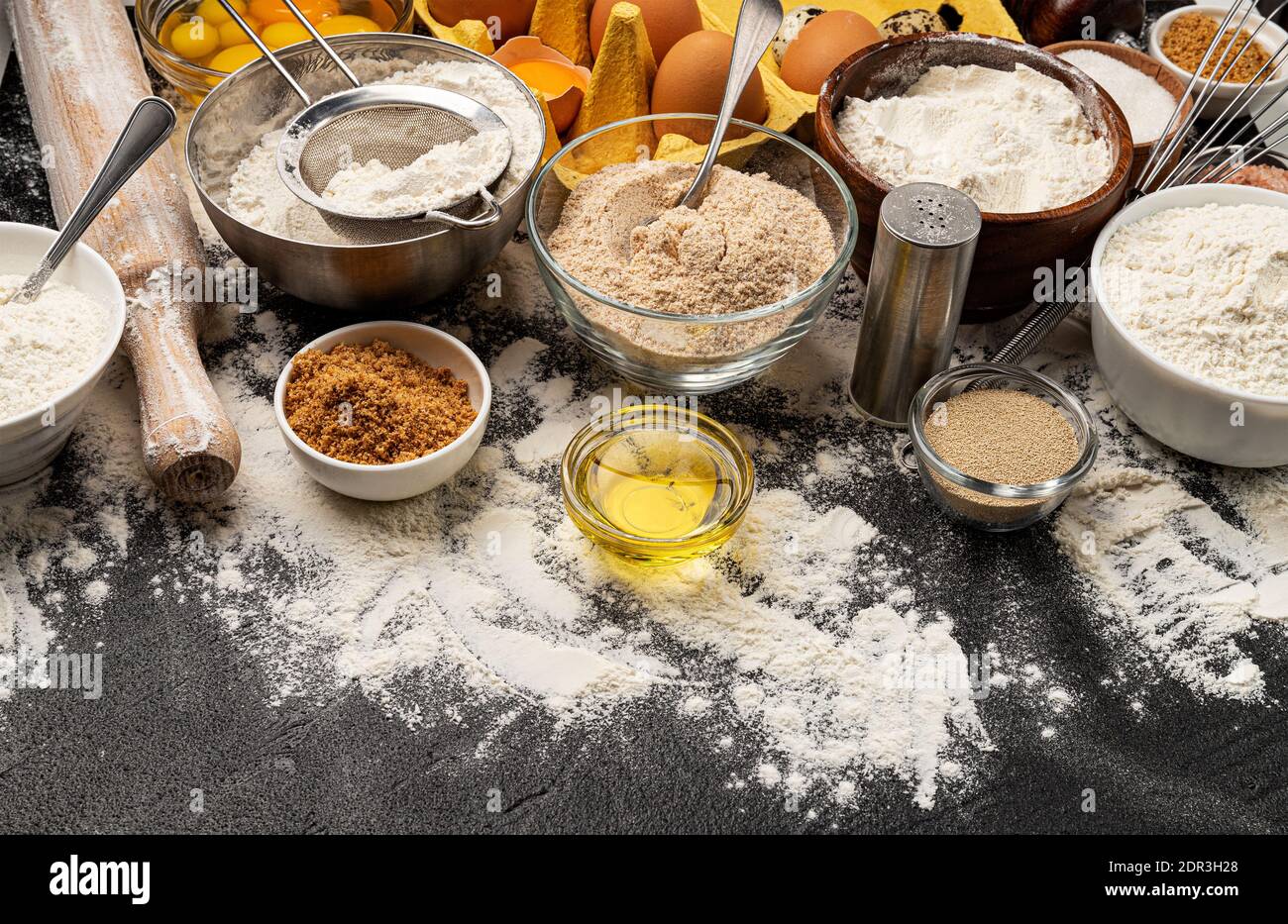 Baking ingredients on black background with copy space Stock Photo - Alamy