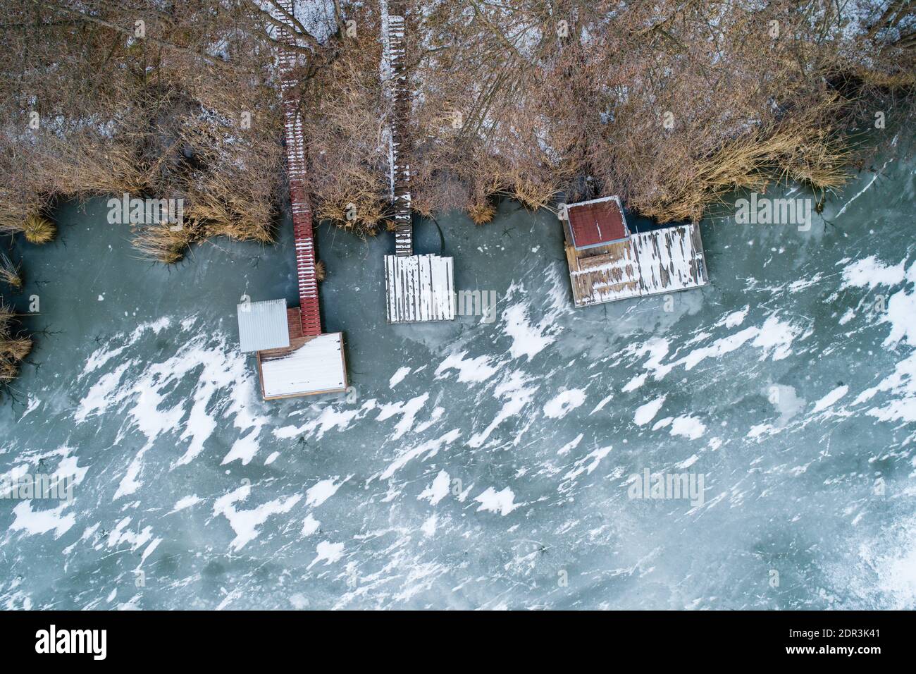 Aerial view of winter frozen lake with wooden houses on pier Stock ...