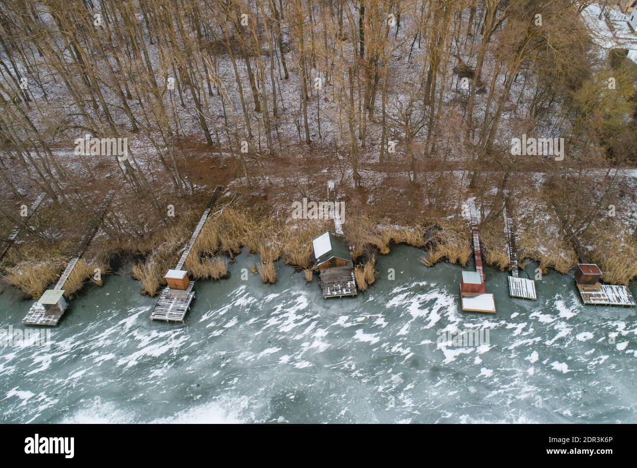 Aerial view of winter frozen lake with wooden houses on pier Stock ...