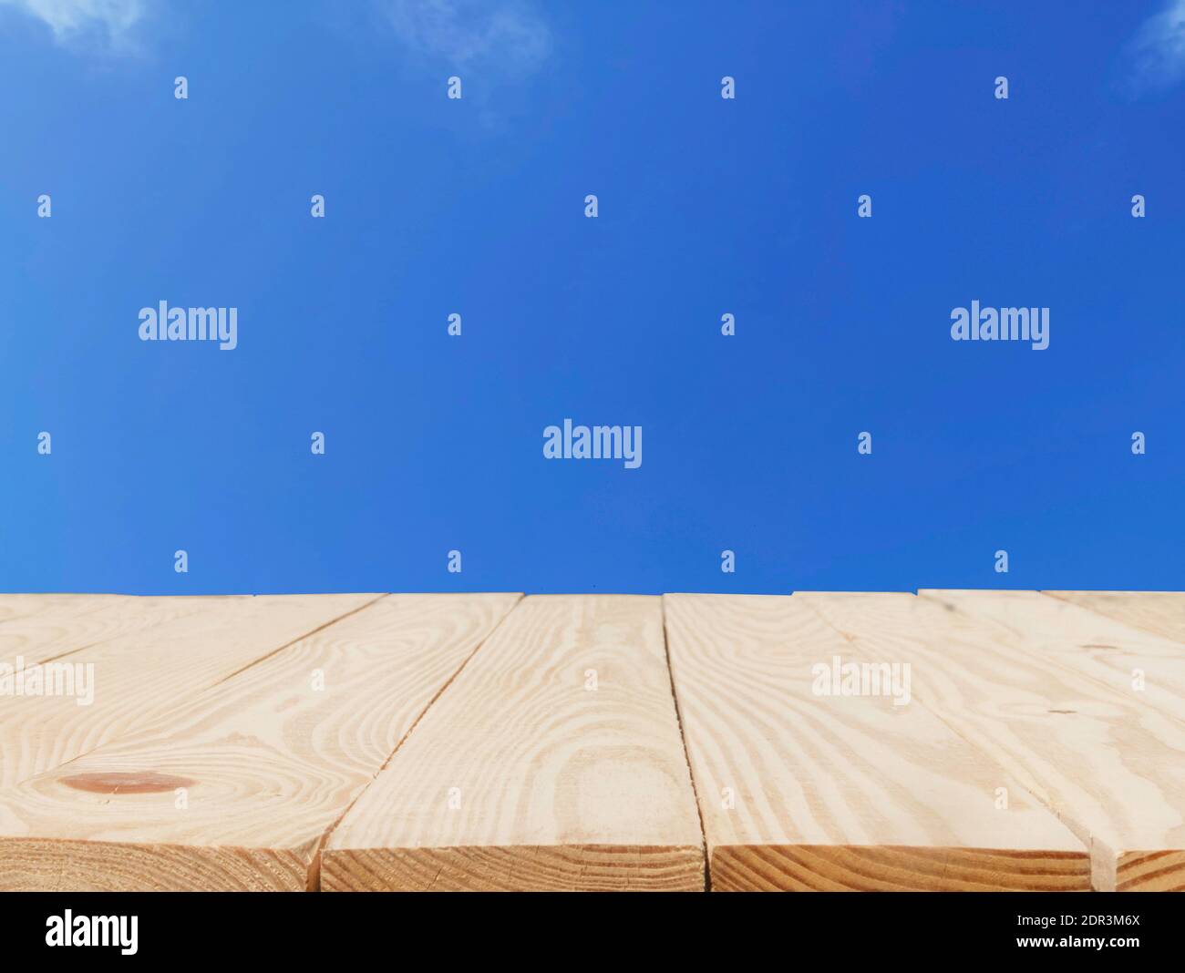 wooden table in front of abstract blurred of blue sky background Stock ...