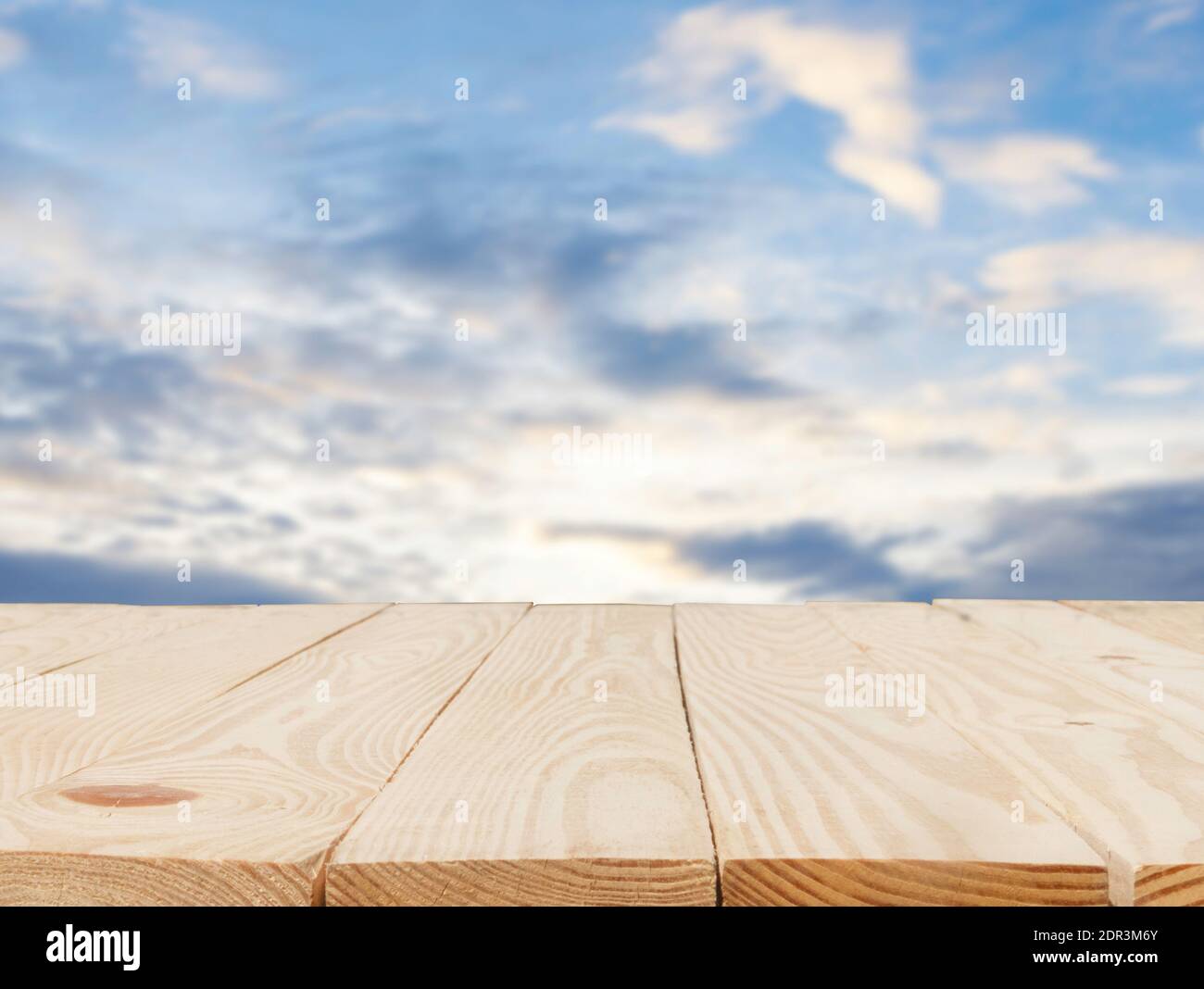 wooden table in front of abstract blurred of blue sky background Stock ...