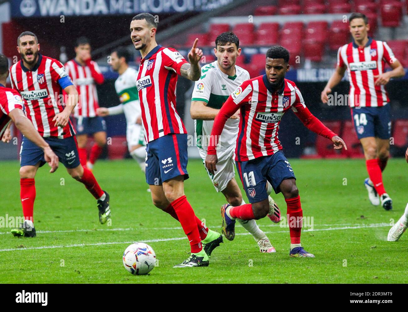 Mario Hermoso of Atletico de Madrid, Lucas Boye of Elche CF and Thomas ...