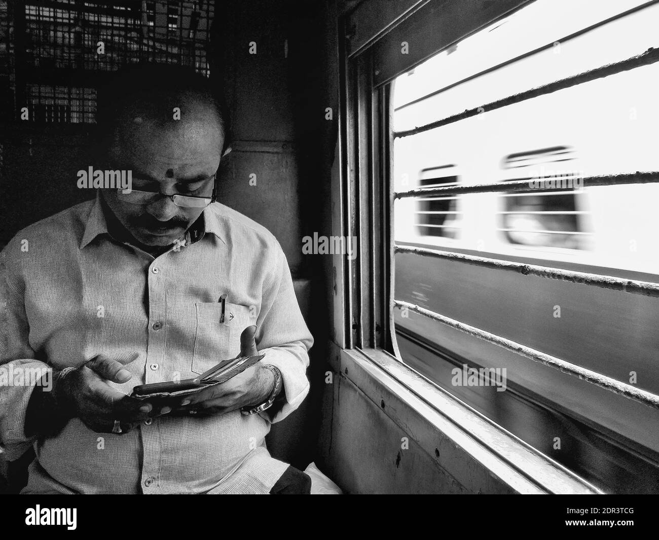 Man sitting train Black and White Stock Photos & Images - Alamy