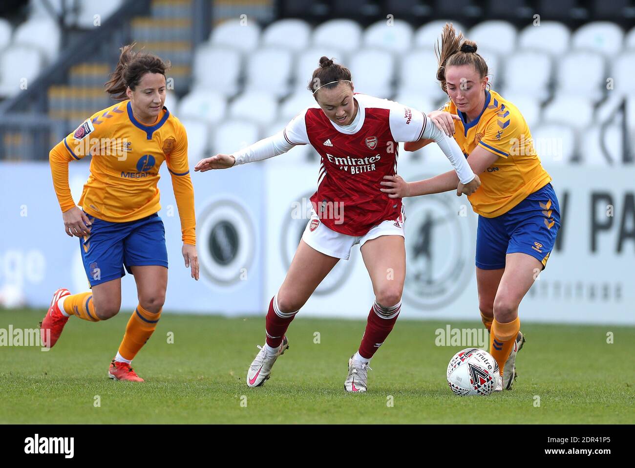 Arsenal goalkeeper Lydia Williams (centre) battles for the ball with ...