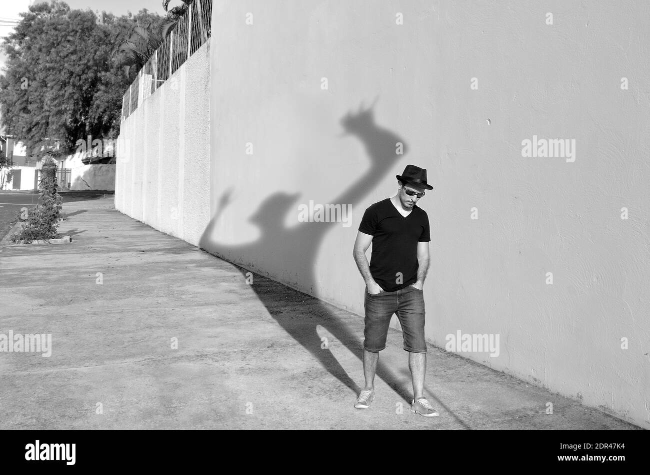 Full Length Of Man Standing Against Wall Stock Photo - Alamy
