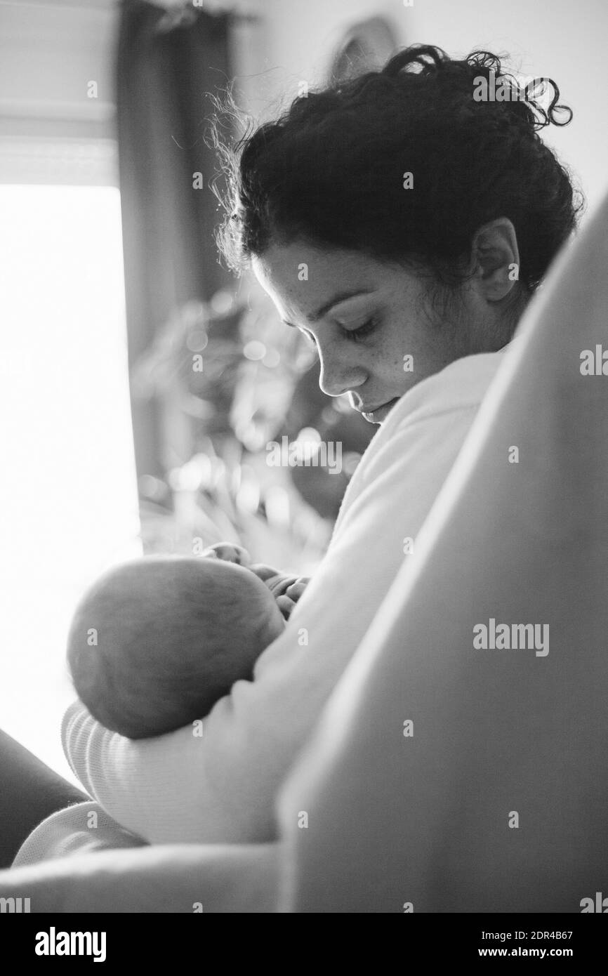 Woman breastfeeding her baby hi-res stock photography and images - Alamy