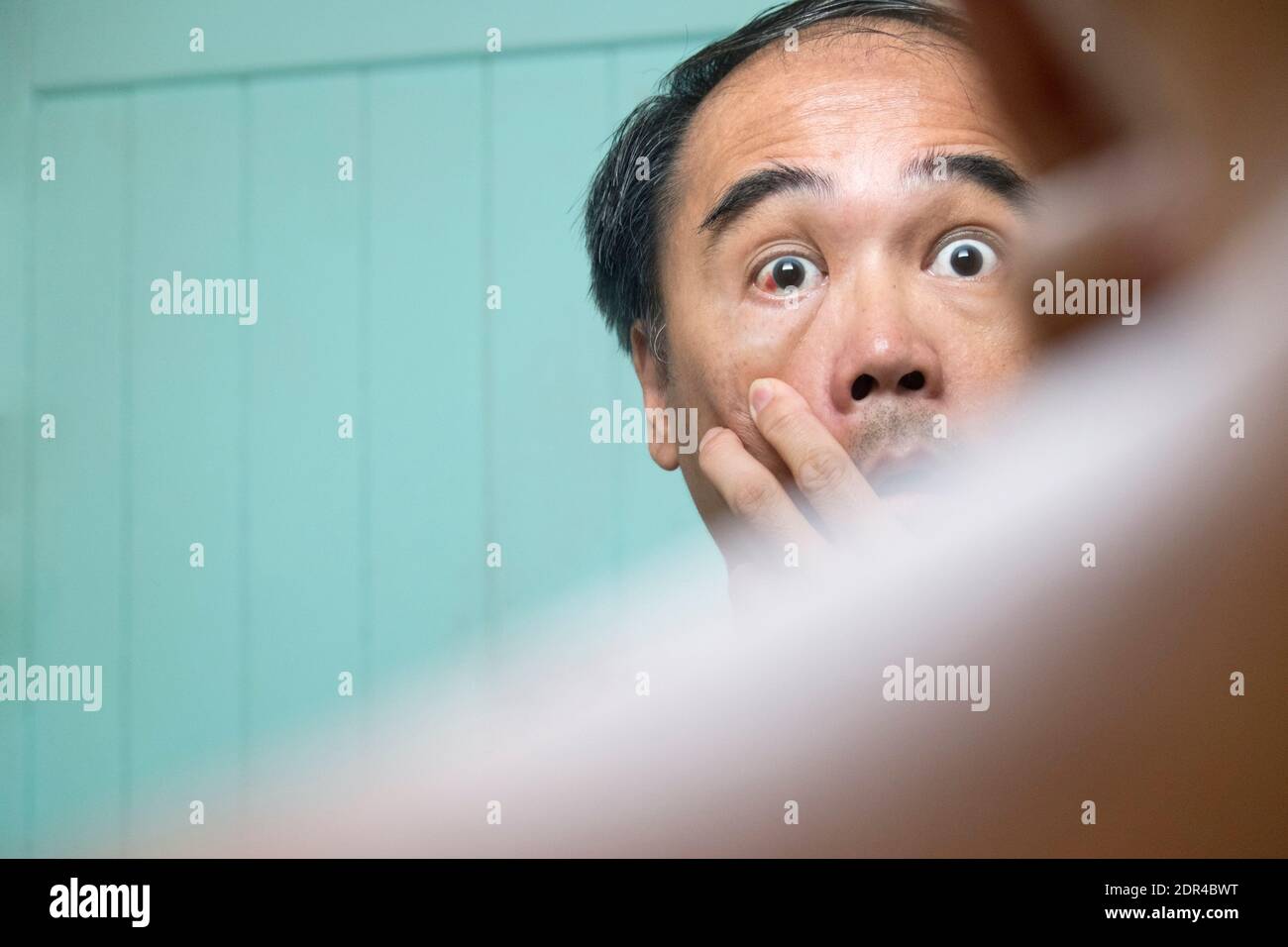 Man body checking mirror hi-res stock photography and images - Alamy