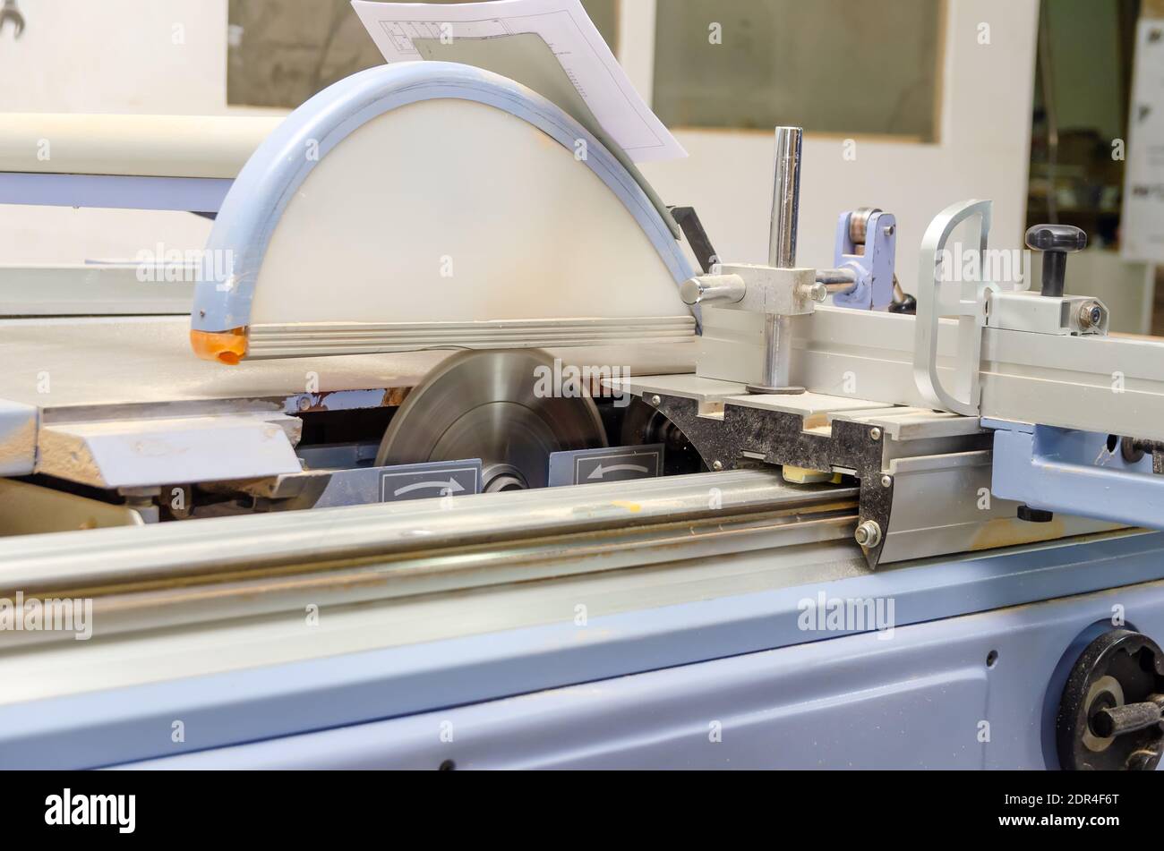 Format-cutting machine in production close-up. Woodworking machine ...