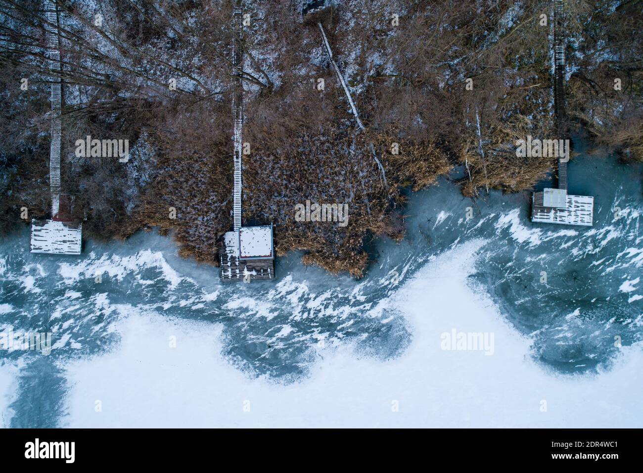 Aerial view of winter frozen lake with wooden houses on pier Stock ...