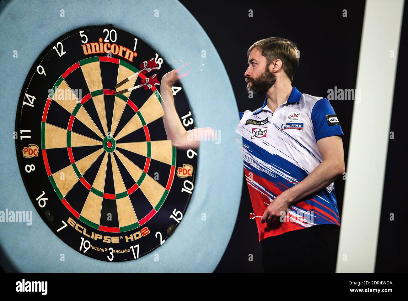 General view of Dmitriy Gorbunov in action and his score on the dart board after two throws ...