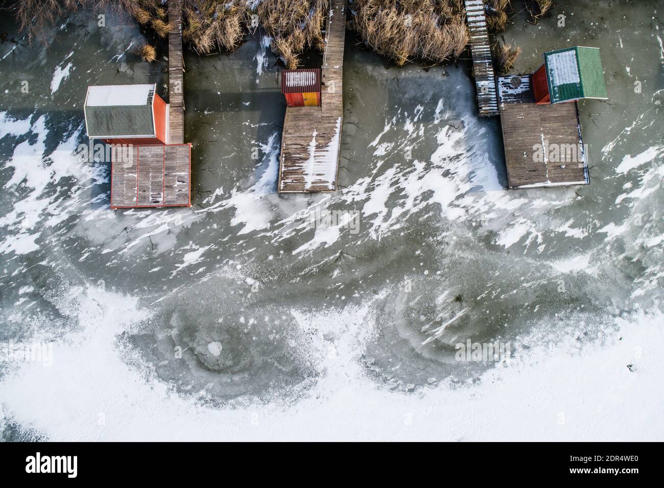 Aerial view of winter frozen lake with wooden houses on pier Stock ...