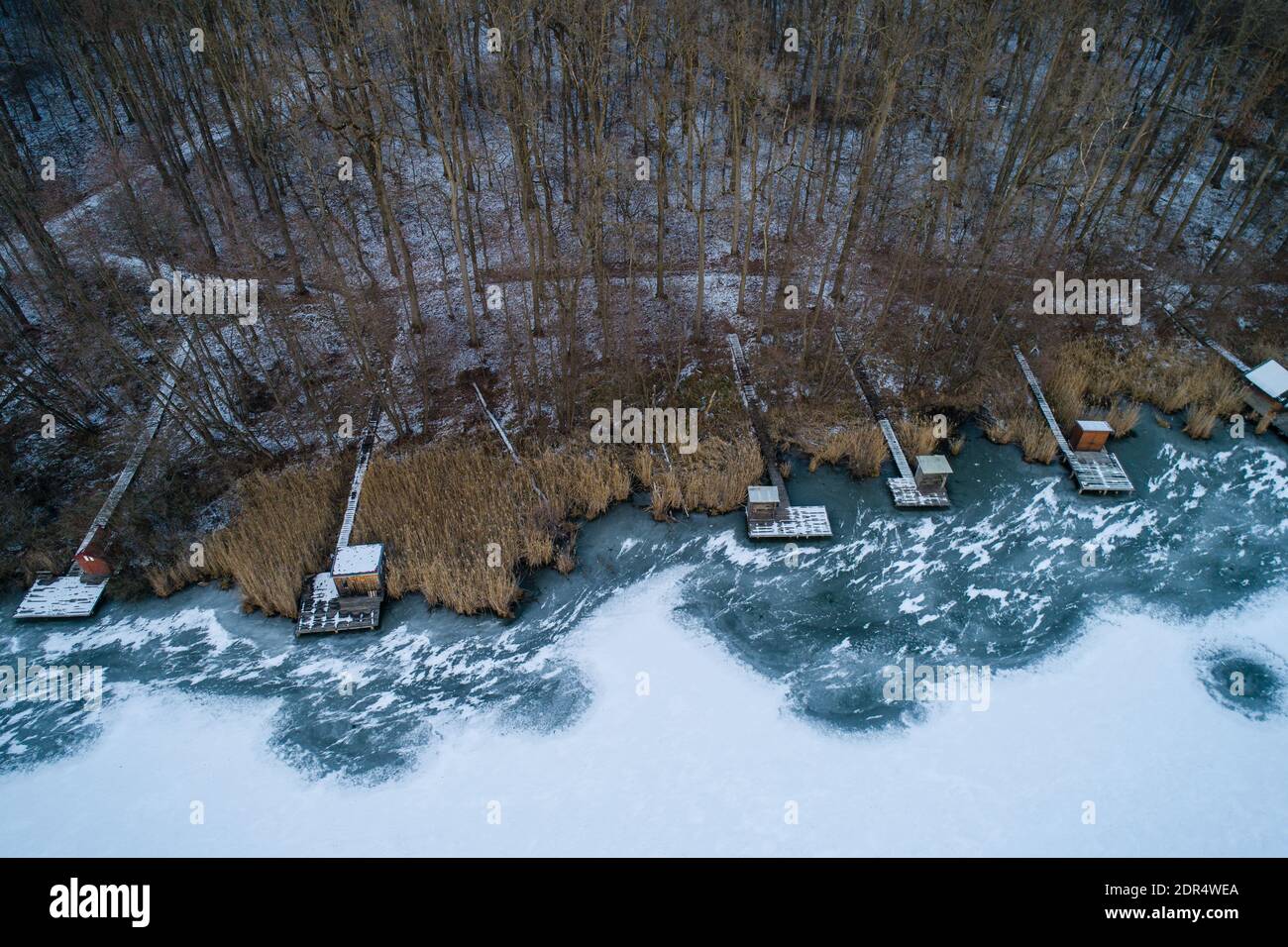 Aerial view of winter frozen lake with wooden houses on pier Stock ...