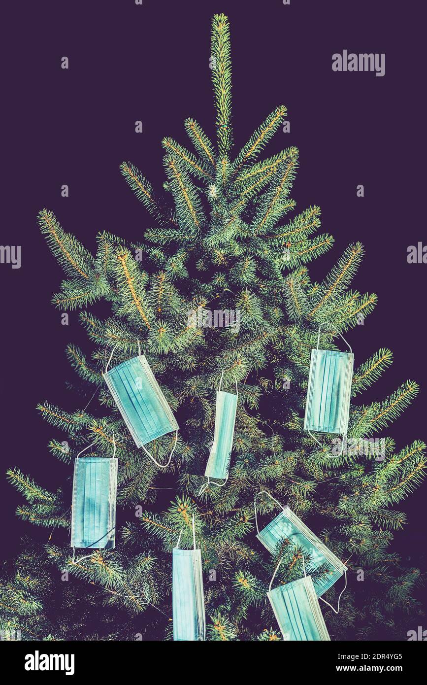 Christmas tree decorated with medical disposable medical masks ...