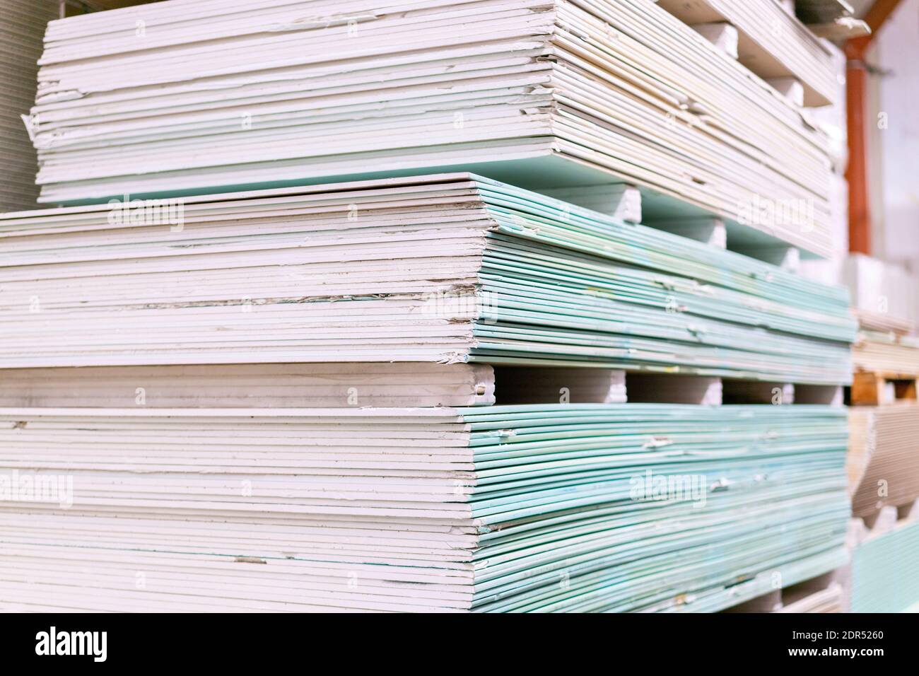 Pallet with Drywall sheets plasterboard in the building warehouse store ...