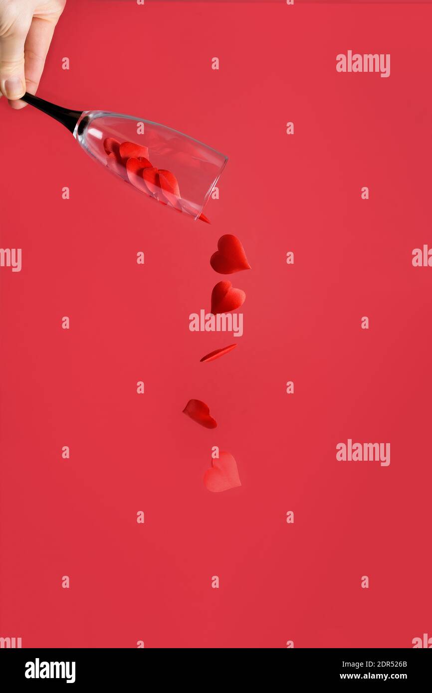 hearts in a glass levitation on a red background, valentine's day ...