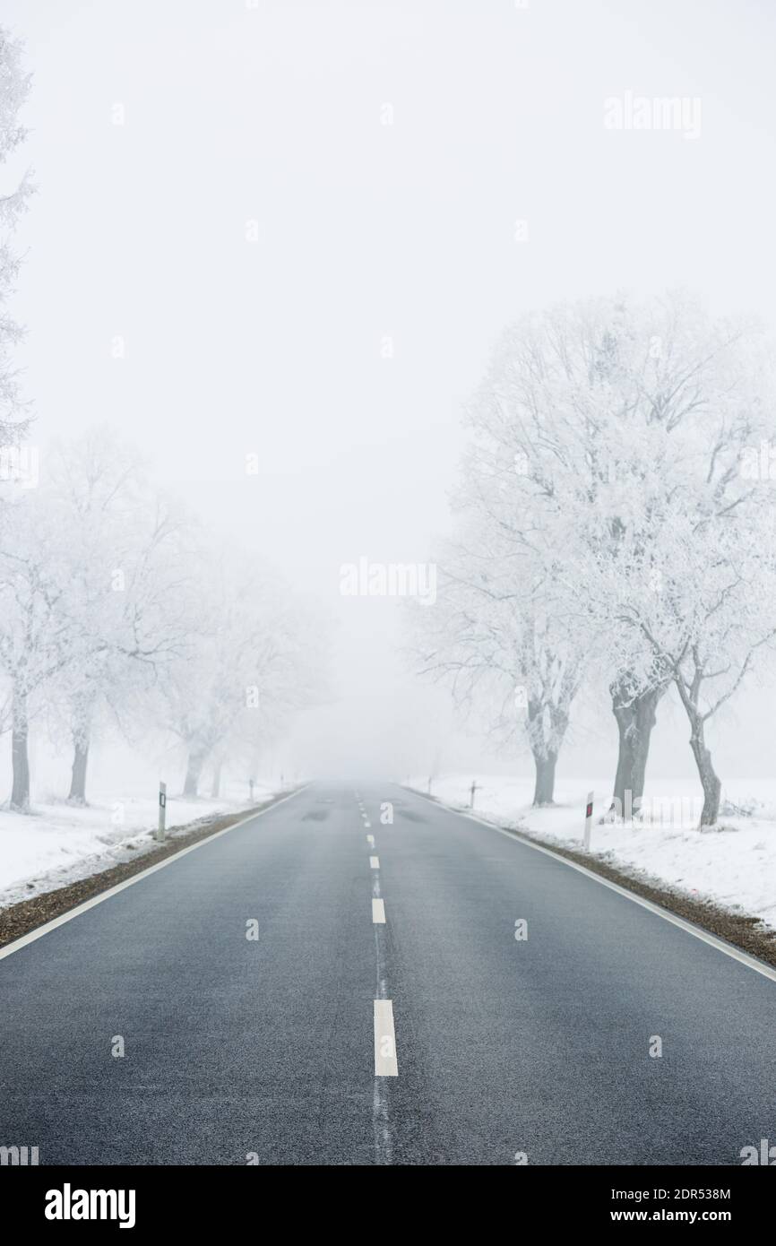 winter warning sign with snow Stock Photo - Alamy