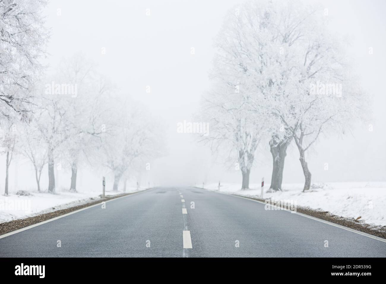 winter warning sign with snow Stock Photo - Alamy