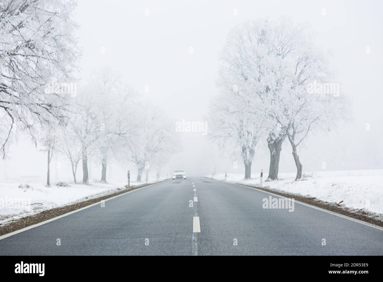 winter warning sign with snow Stock Photo - Alamy