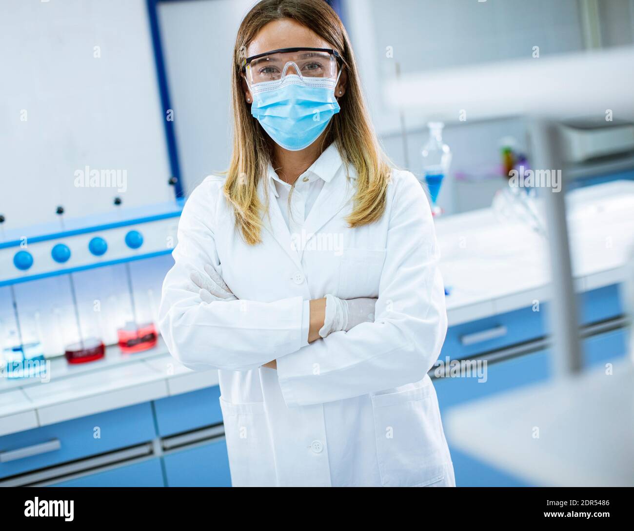 Young female researcher analyzing chemical data in the flocculator at ...