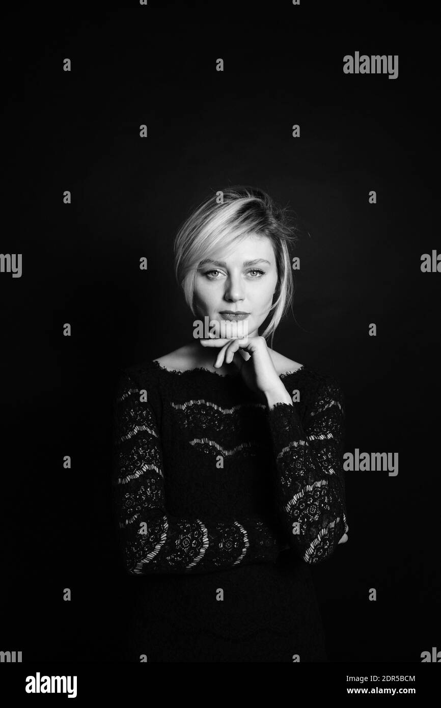 Portrait Of Woman Standing Against Black Background Stock Photo - Alamy