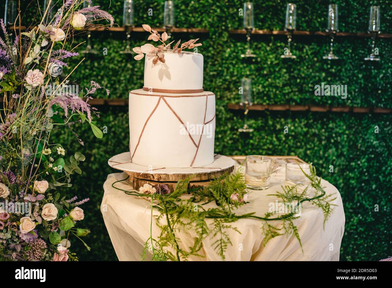 Birthday white cake in interior decorated with natural elements and ...