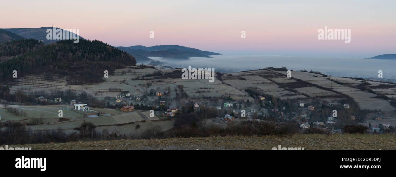valley between small mountains covered with smog Stock Photo - Alamy