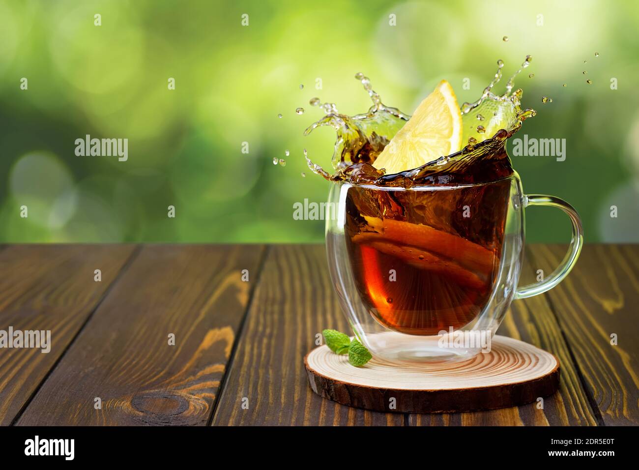 cup with tea splash Stock Photo - Alamy