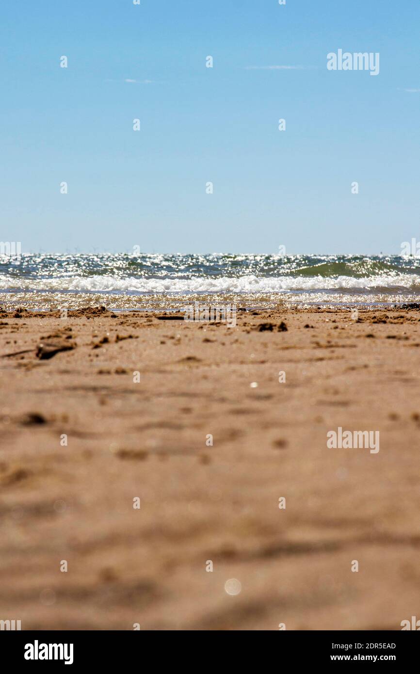 Low angle shot of the beach looking towards Frinton with shallow depth ...