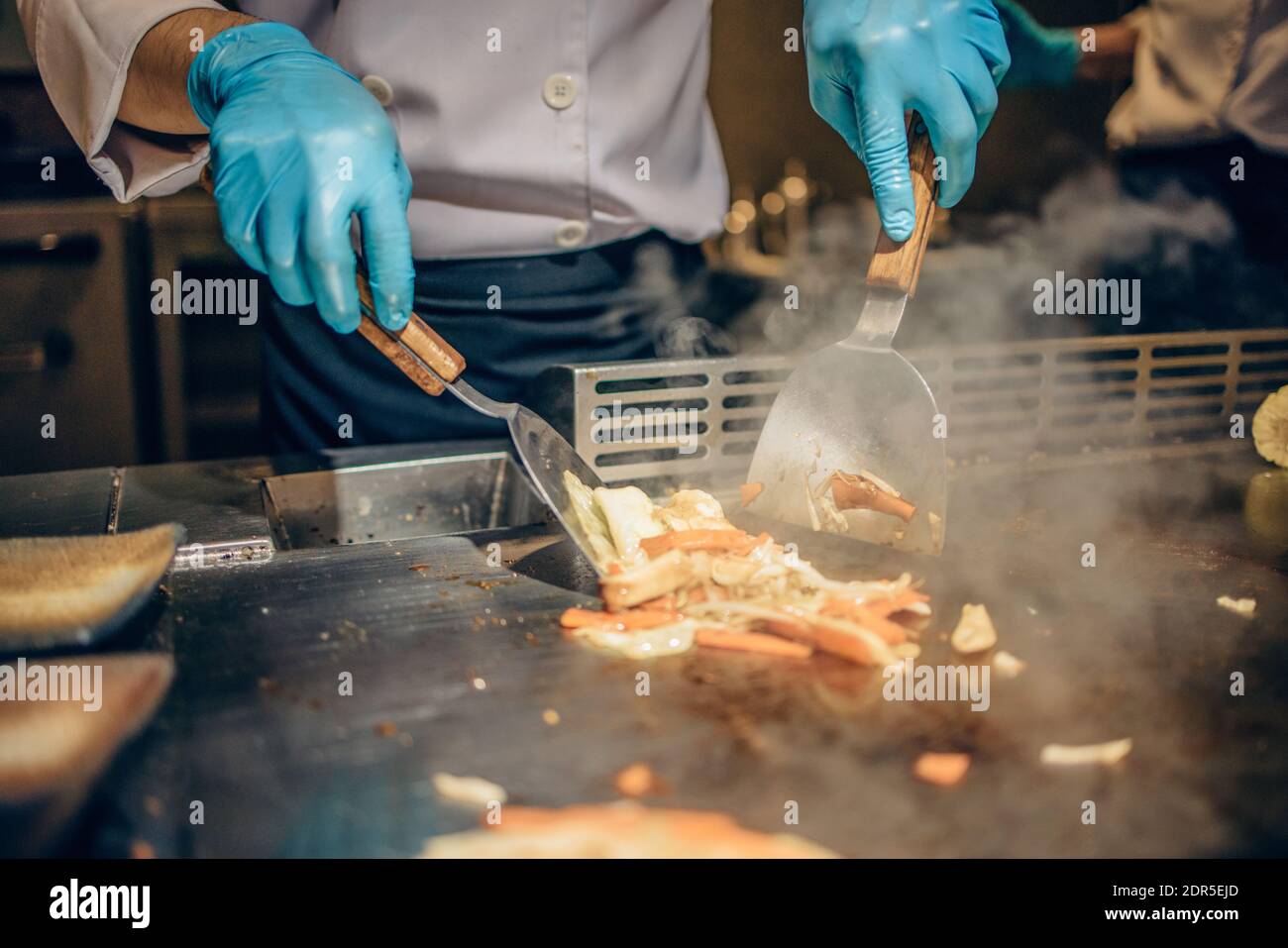 Hand of man take cooking of meat with vegetable grill, Chef cooking ...