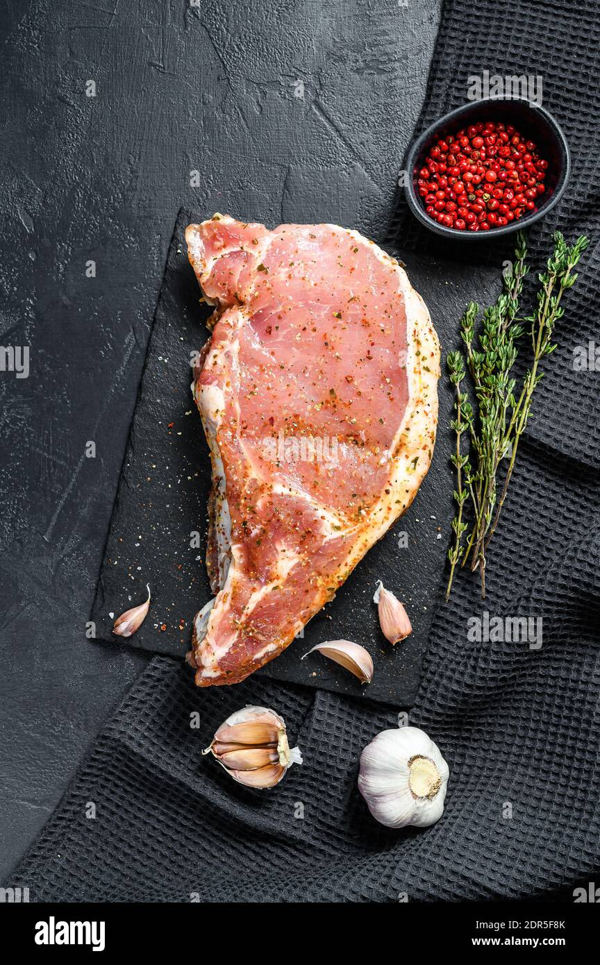 Pork on bone. Cutlet for frying grilling. With spices and ingredients ...