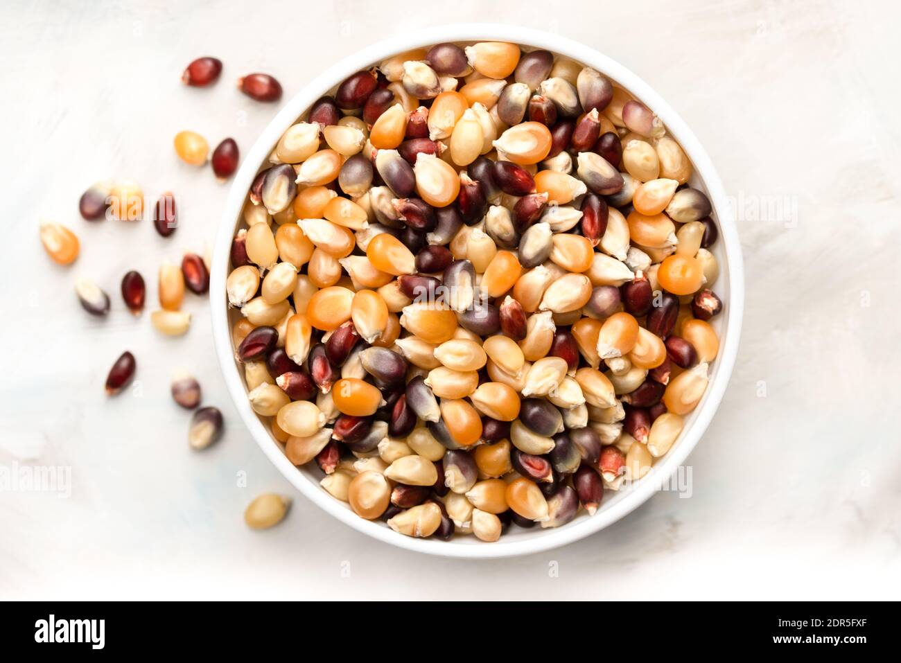 Multi Colored Popcorn Kernels in a Bowl Stock Photo - Alamy