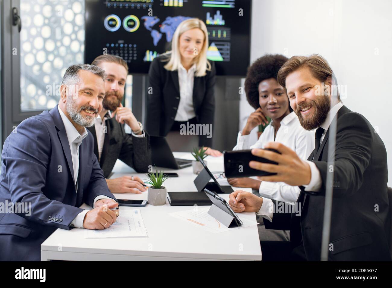 Team of good-looking smiling successful diverse corporate coworkers ...