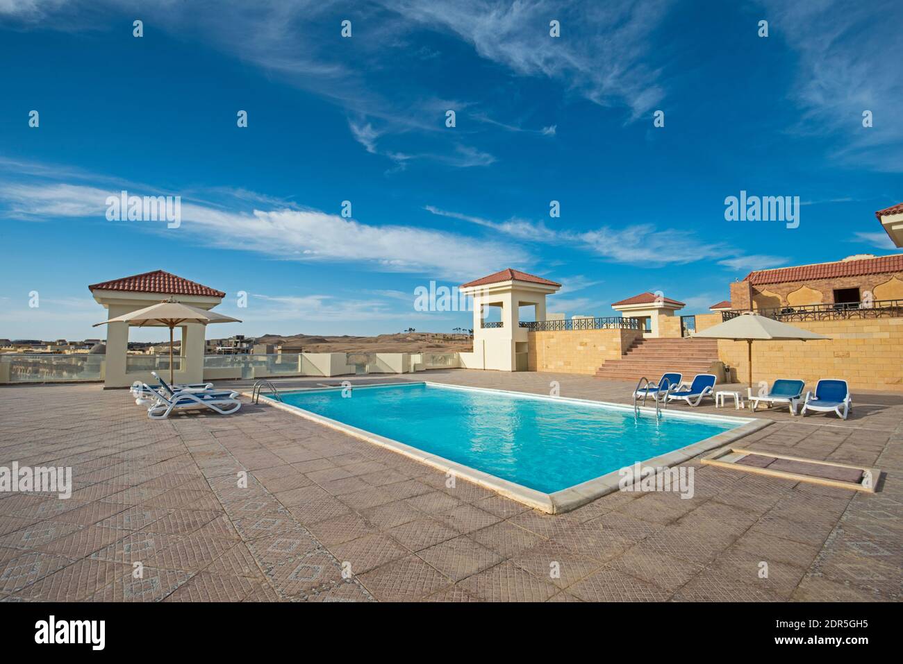 Large rooftop swimming pool at a luxury tropical hotel resort Stock ...