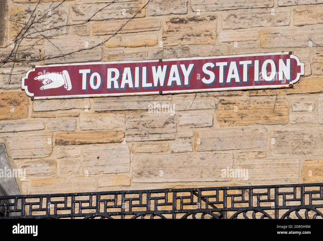 Enamel sign pointing to the railway station at Beamish Museum, Co ...