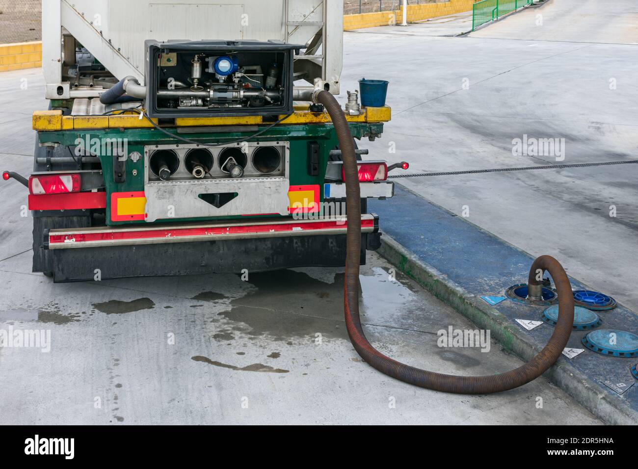 Tank truck unloading adblue with meter and by gravity in a tank on the ...