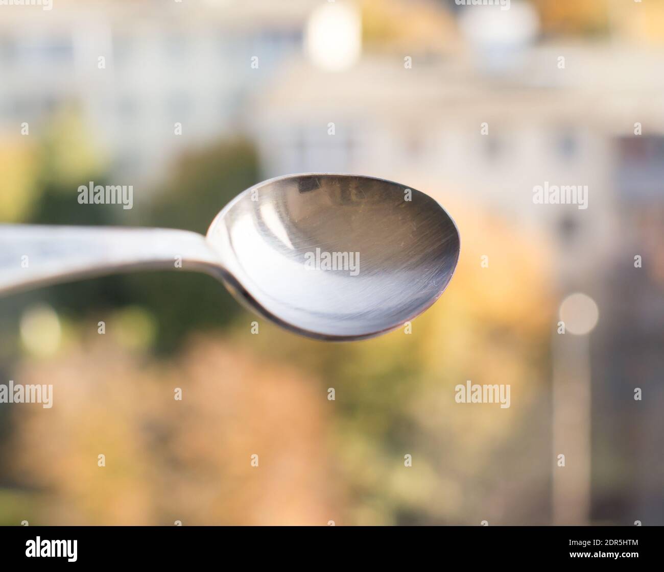 The cupronickel spoon object Stock Photo - Alamy