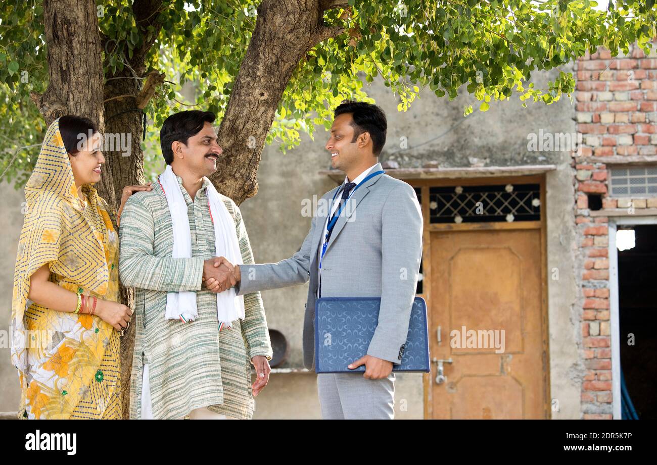 Indian woman shaking hands hi-res stock photography and images - Alamy