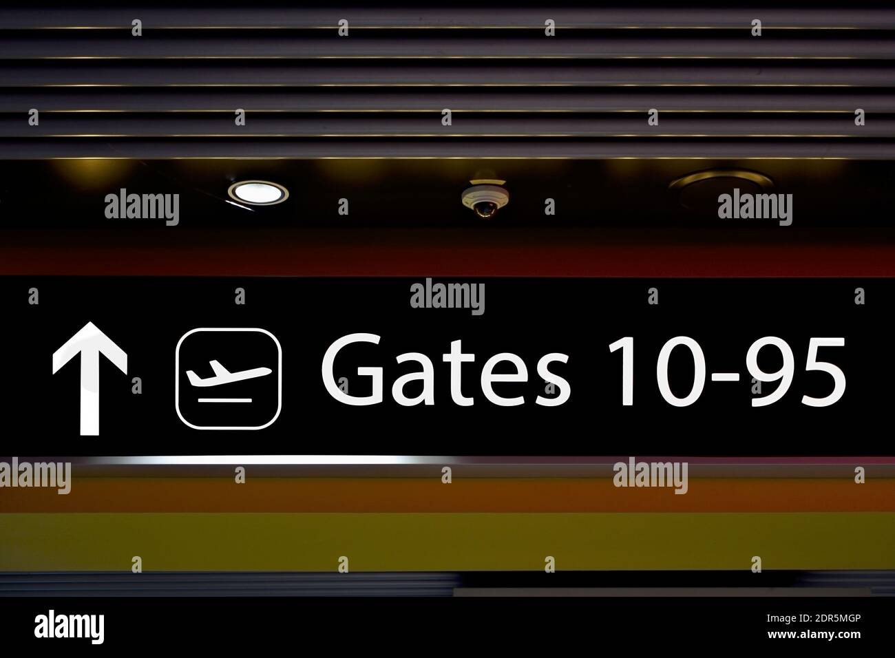 Airport terminal interior, departure gate sign information indicating ...