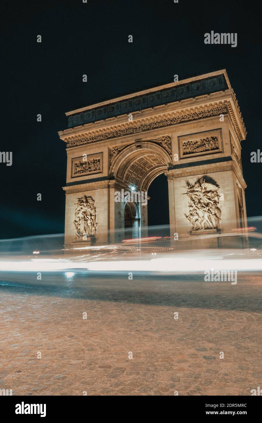 A breathtaking view of Triumphal Arch in Paris at night, France Stock ...