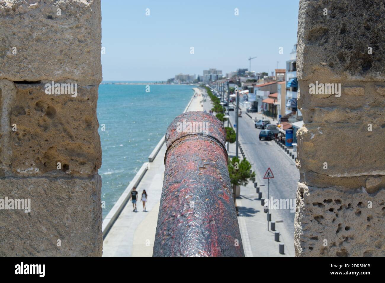 Cannons on the wall of Medieval Castle of Larnaca Fort and blue sea in ...