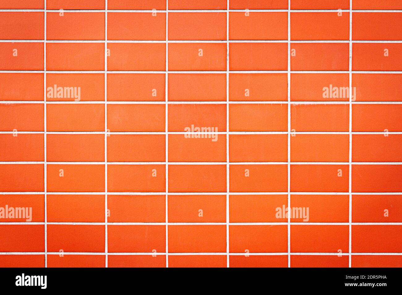 Modern weathered red tile wall texture background Stock Photo - Alamy