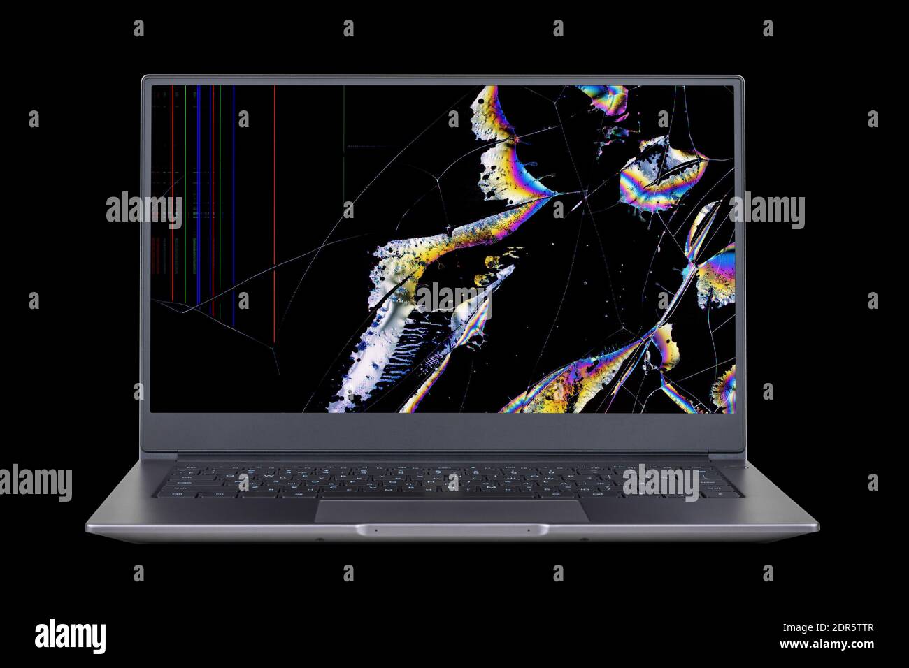 laptop with a broken screen in color spots and cracks isolated on black ...