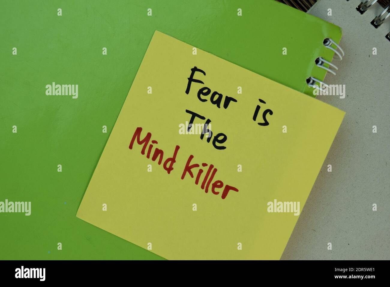Fear is the Mind Killer write on sticky notes isolated on Wooden Table ...