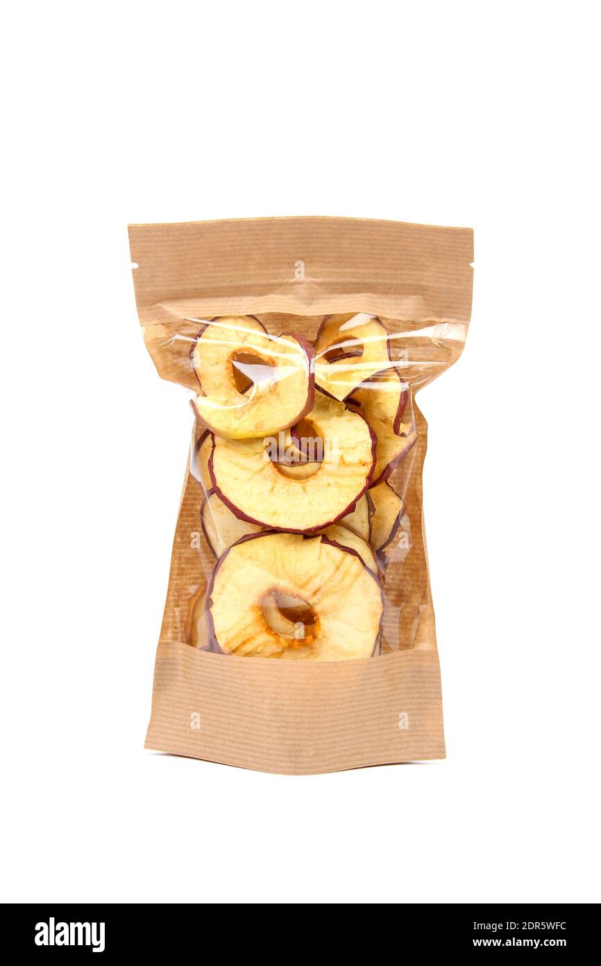 Apple chips in paper packaging isolated on a white background close up ...