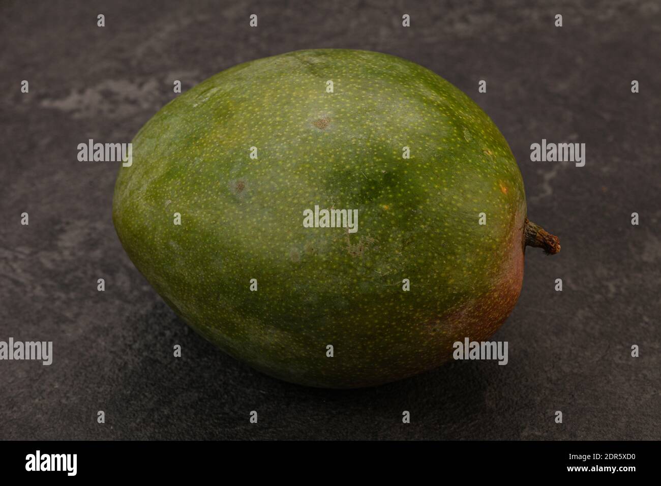 Tropical fruit - Green sweet tasty mango Stock Photo - Alamy
